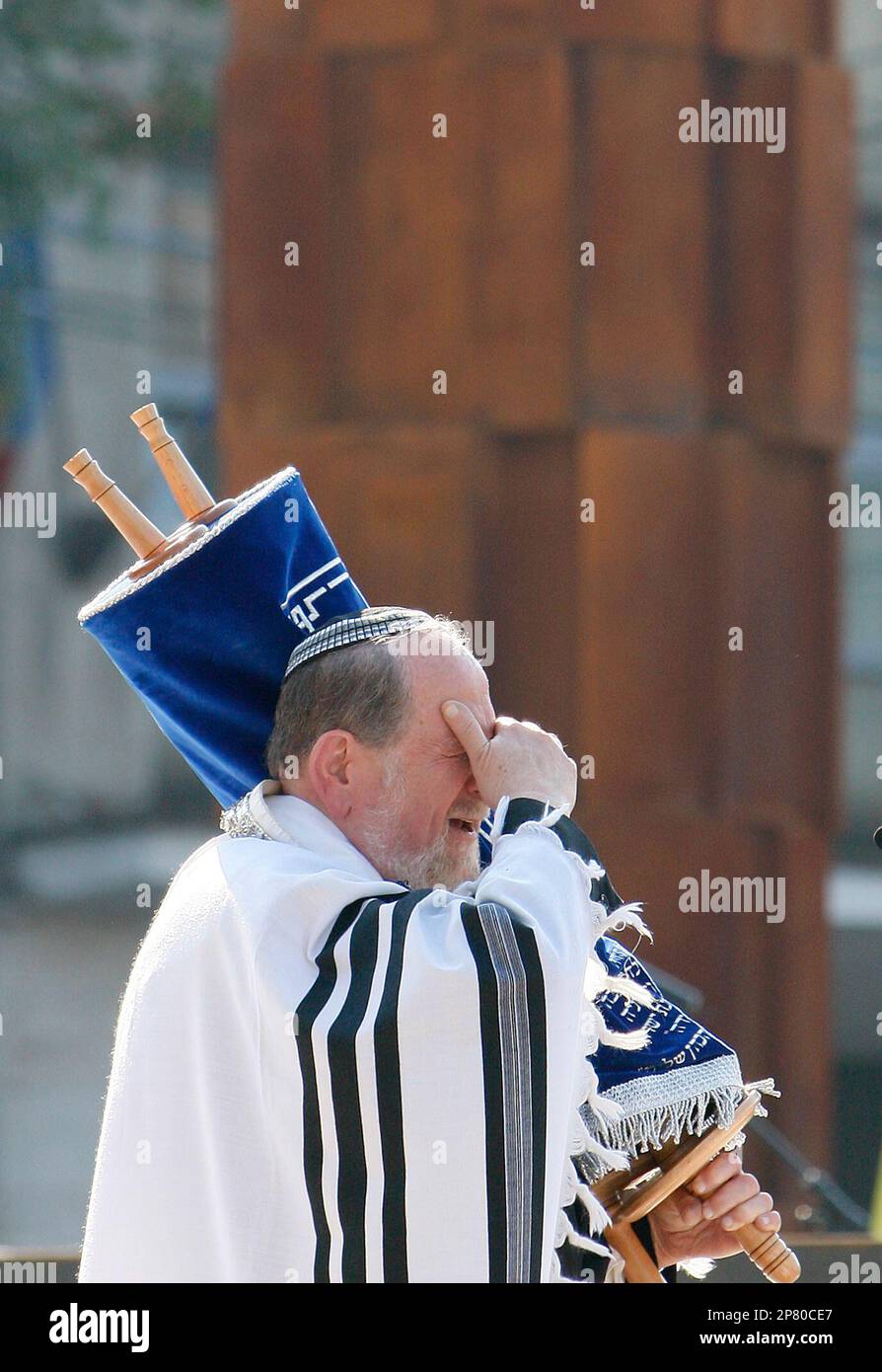 The Chief Rabbi of Romania, Menachem Hacohen, reacts while saying a ...