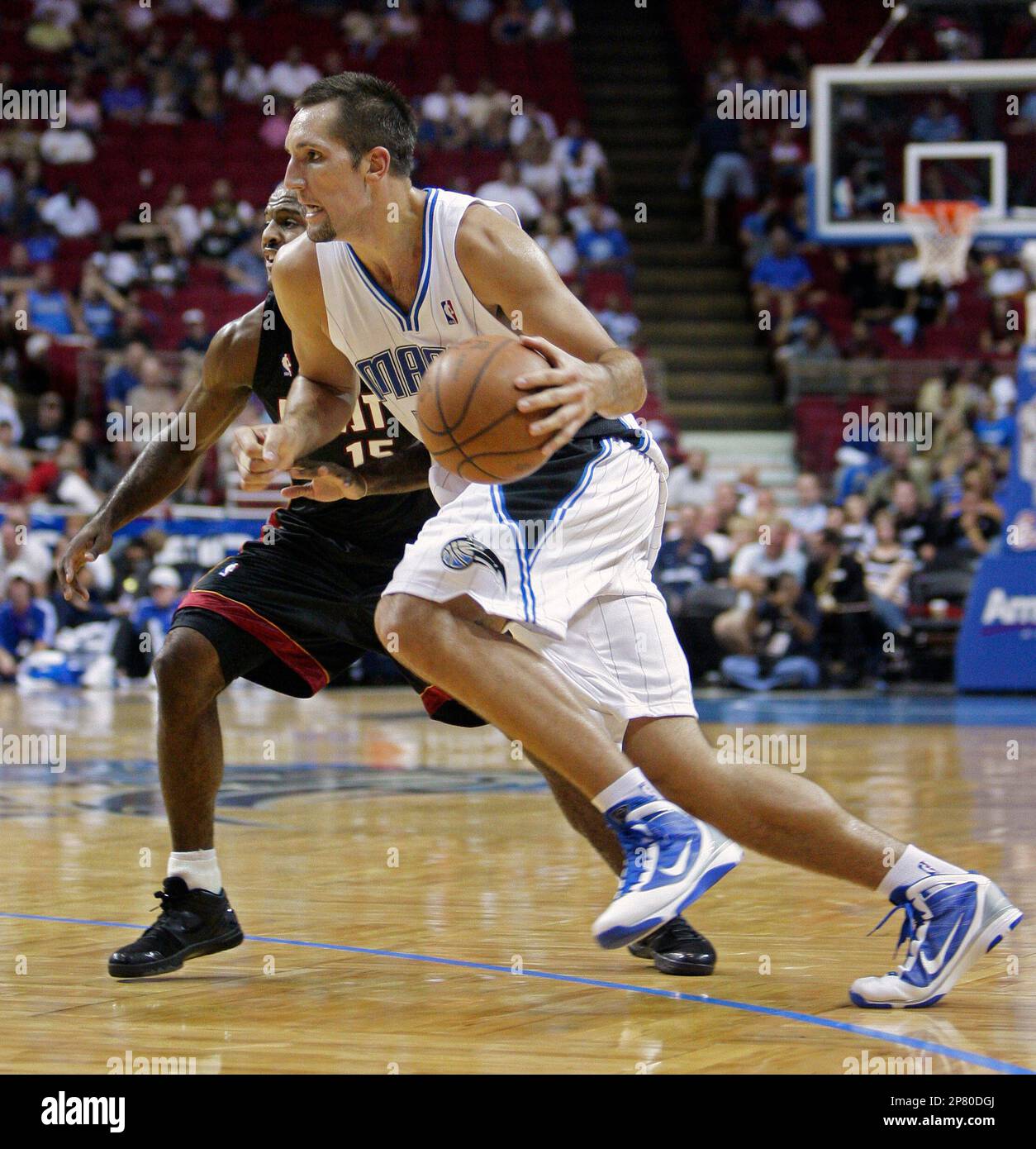 Orlando Magic forward Ryan Anderson, right, drives past Miami Heat ...