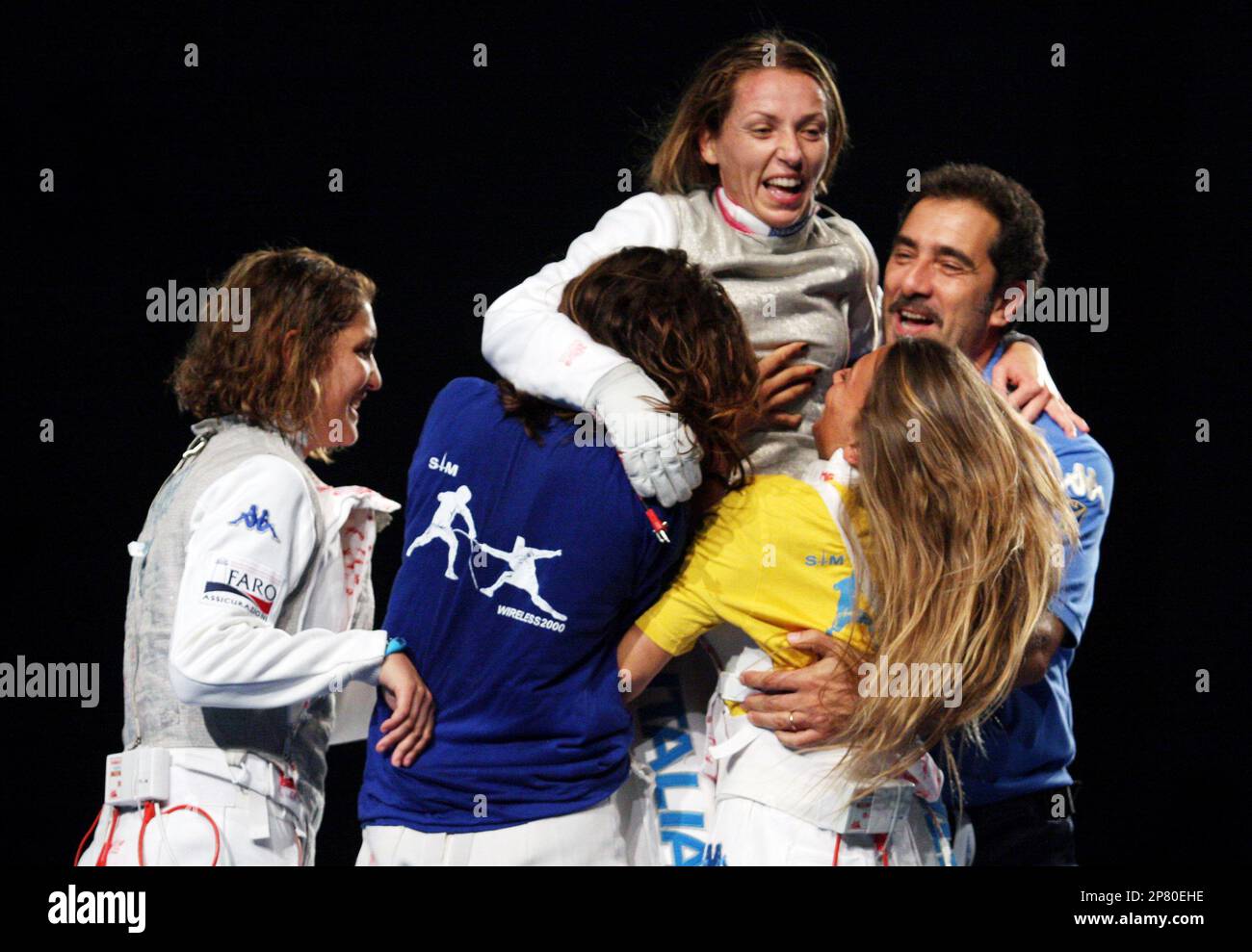 The Italian team celebrate their gold medal during the Fencing World ...