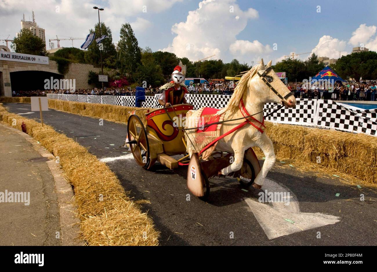 An Israeli dressed as a gladiator rides his self-made race vehicle ...