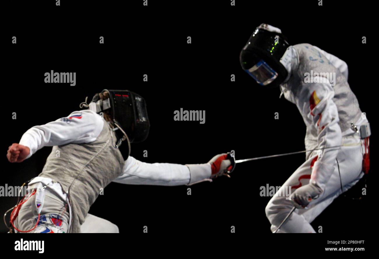 Artem Sedov of Russia, left, and Shenk Lei of China compete for the ...