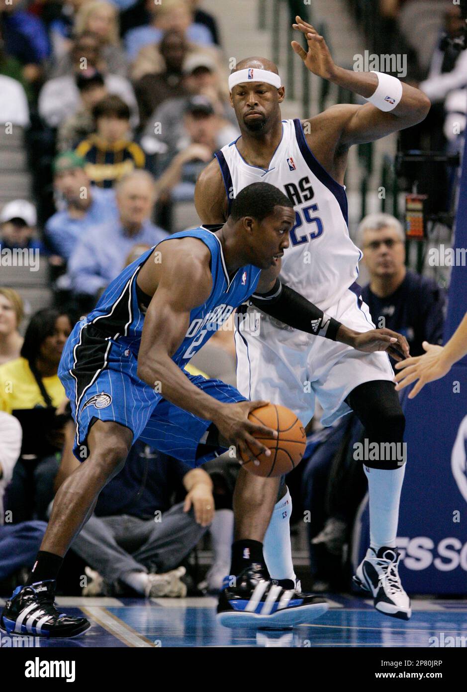 Orlando Magic center Dwight Howard, left, attempts to get to the basket ...