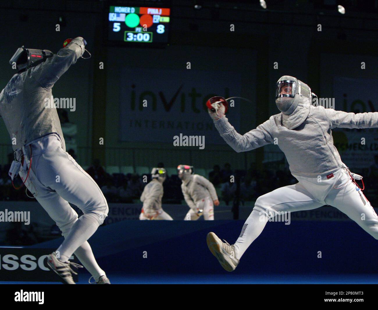 Aron Szilagyi of Hungary, left, and Bjoern Huebner of Germany compete ...