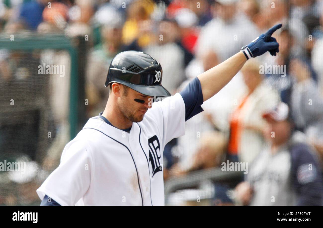 Detroit Tigers' Ryan Raburn reacts on his way back to the dugout after ...