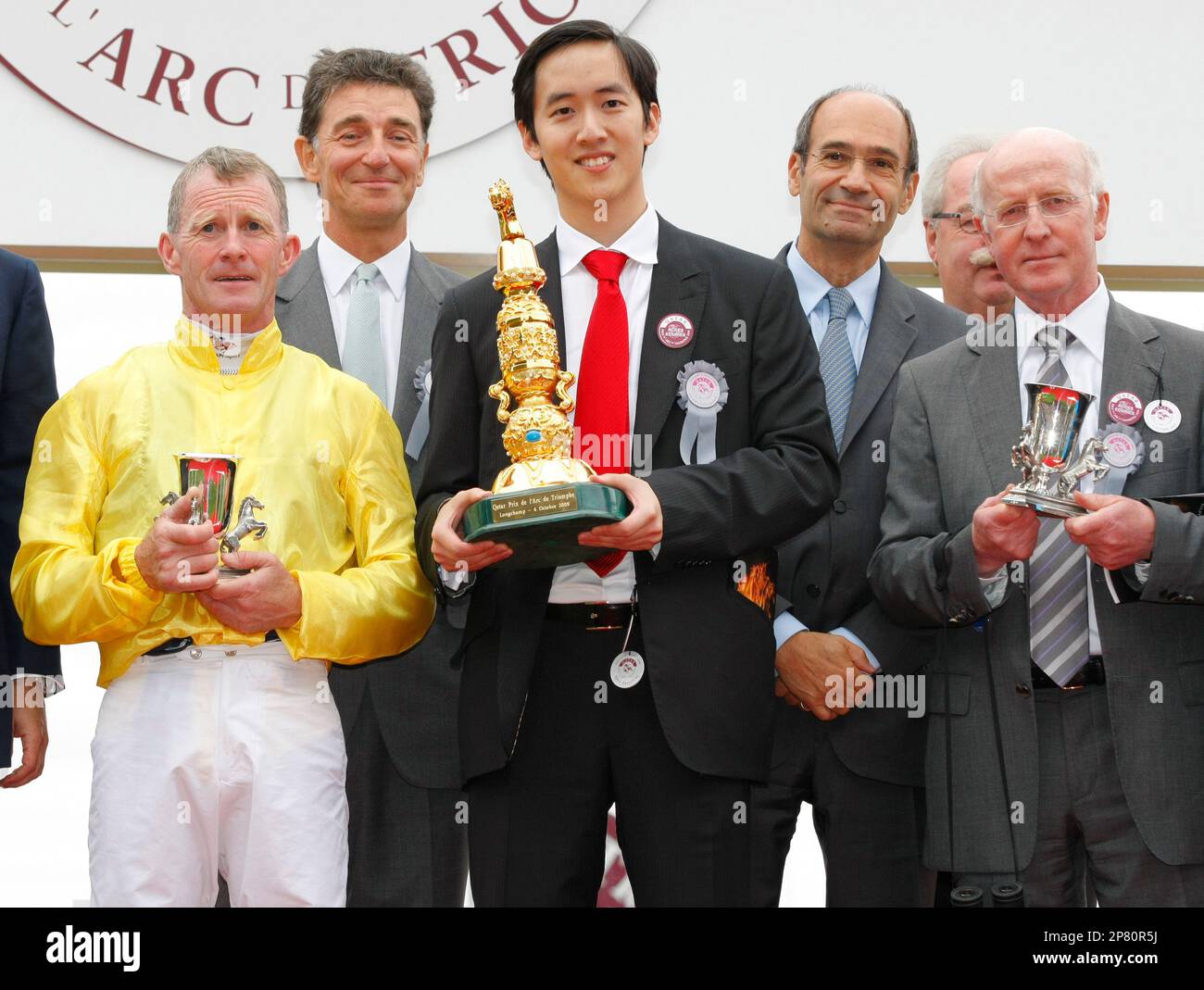 From left in foreground, jockey Mick Kinane, horse owner Christopher ...
