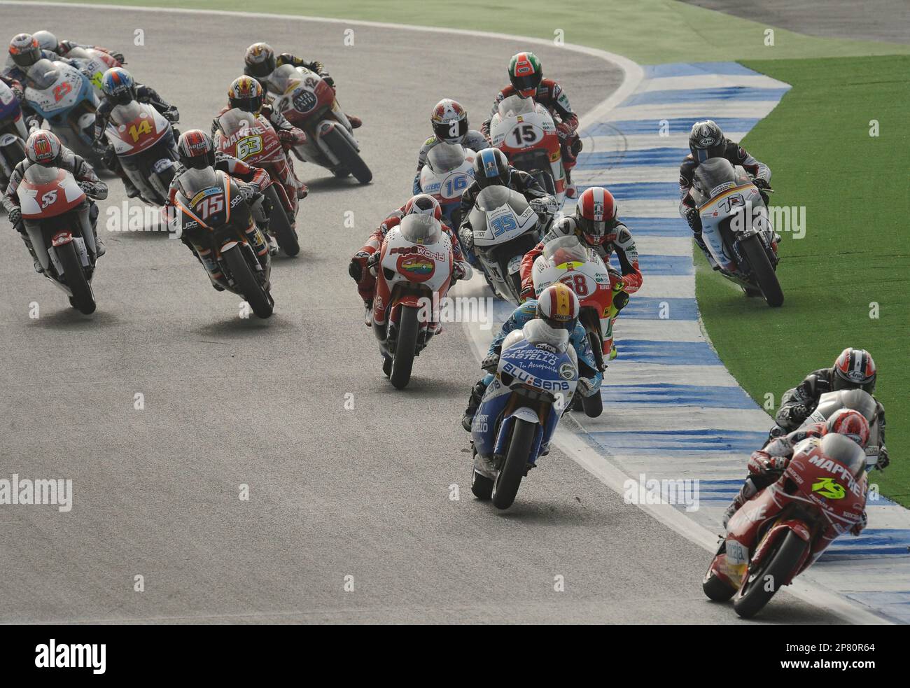Riders take the first curve during the 250cc race of the Portugal Grand ...