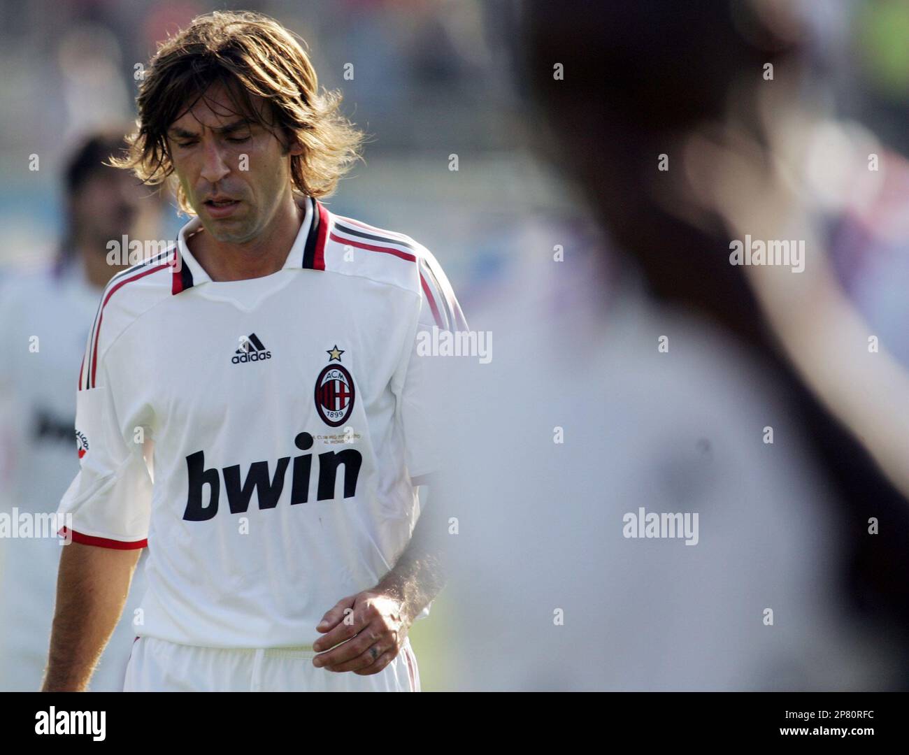 AC Milan midfielder Andrea Pirlo walks off the pitch at the end of a ...