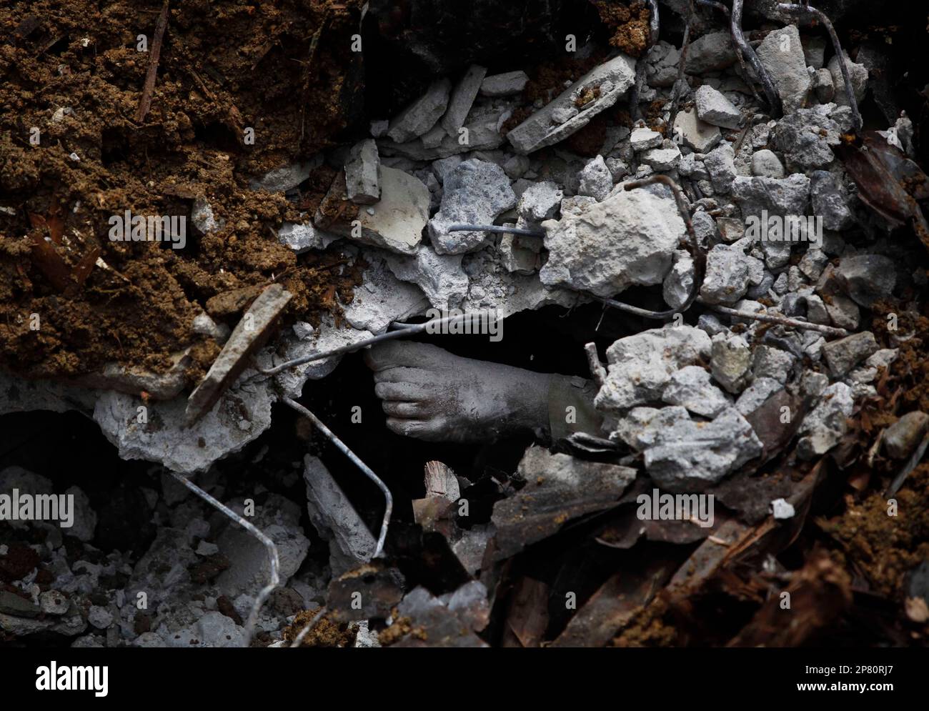 The foot of an Indonesian villager who was buried in a landslide ...