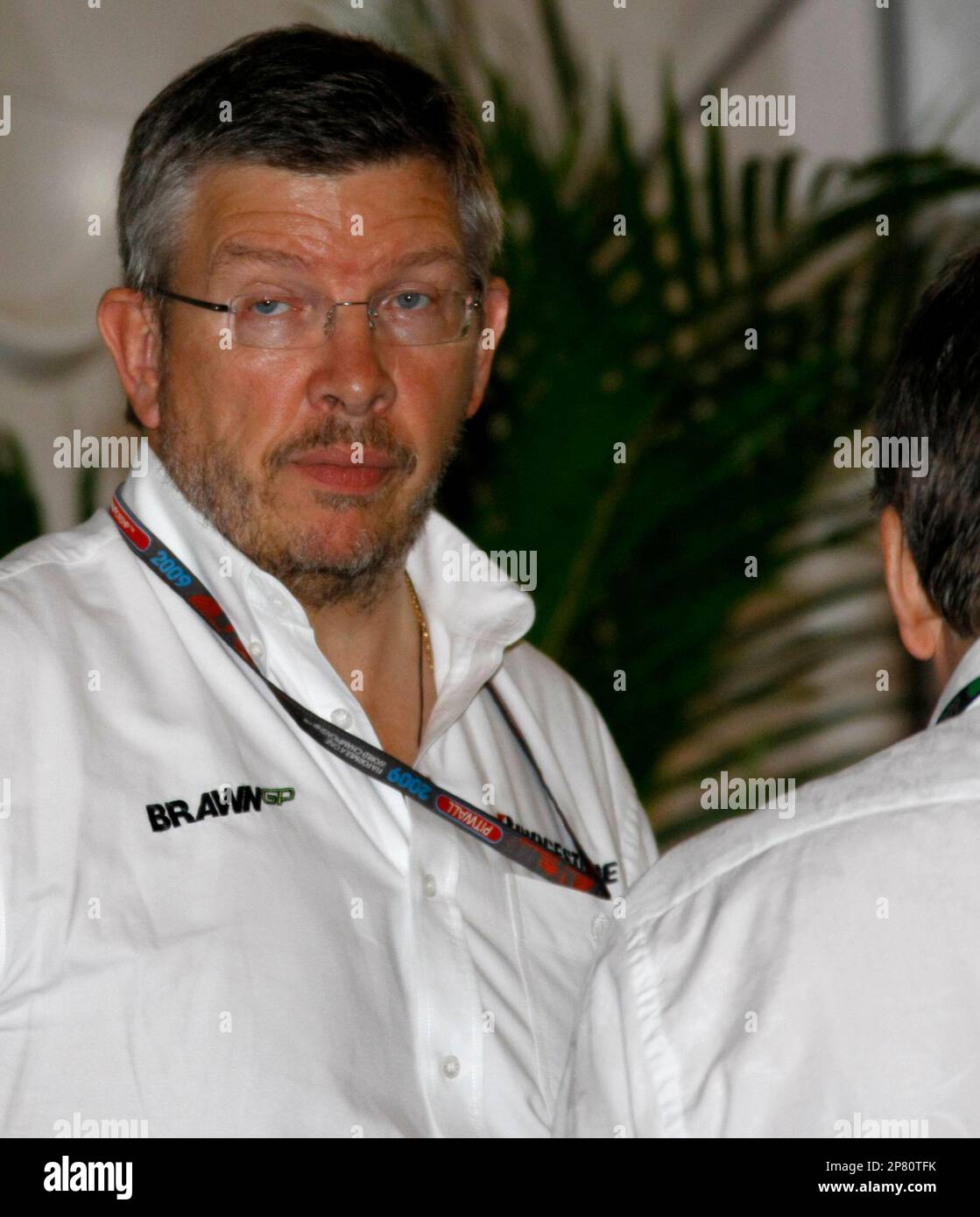 Brawn GP team principal Ross Brawn looks on at his motor home after the ...