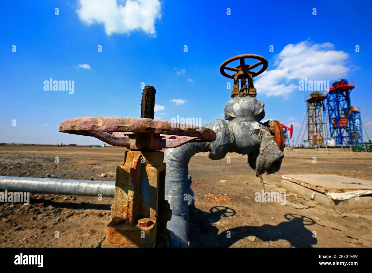 Oil pipes and valves Stock Photo - Alamy