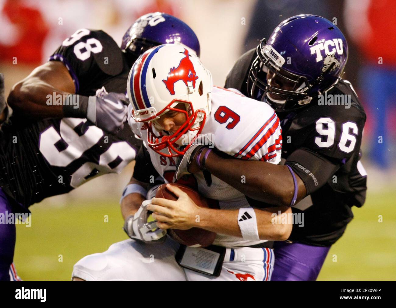 SMU quarterback Bo Levi Mitchell (9) is sacked for a loss by TCU ...