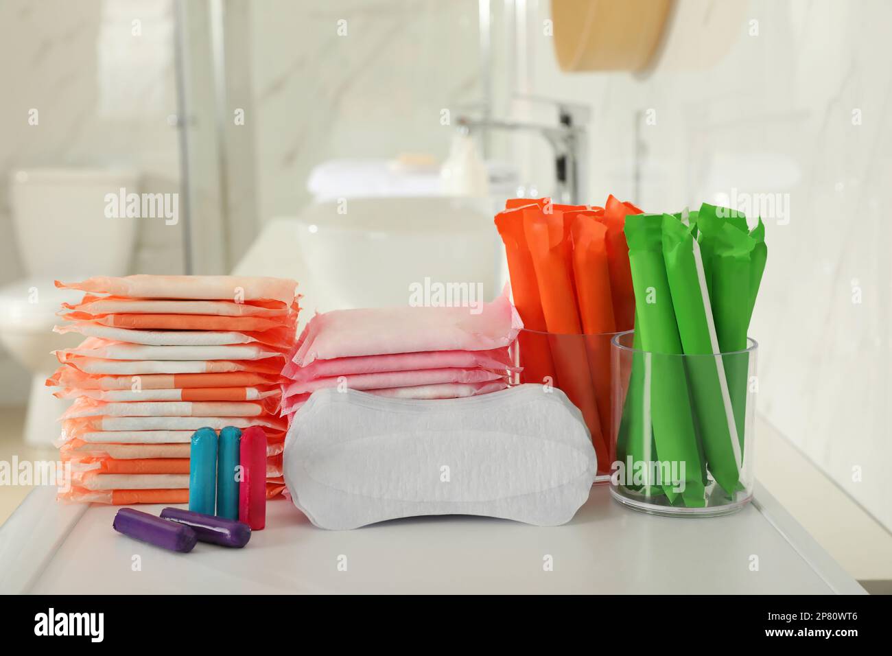 Different feminine hygiene products on counter in bathroom Stock Photo ...