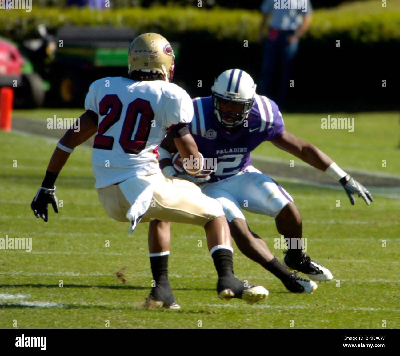 Elon's Cameron McGlenn (20) tries to stop Furman's Adam Mims (2) during ...