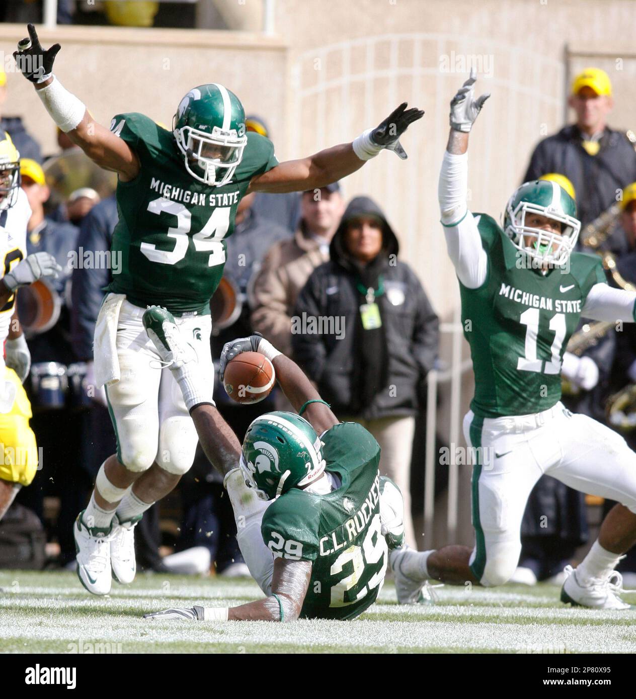 Michigan State's Brandon Denson (34), Chris L. Rucker (29), and Marcus ...
