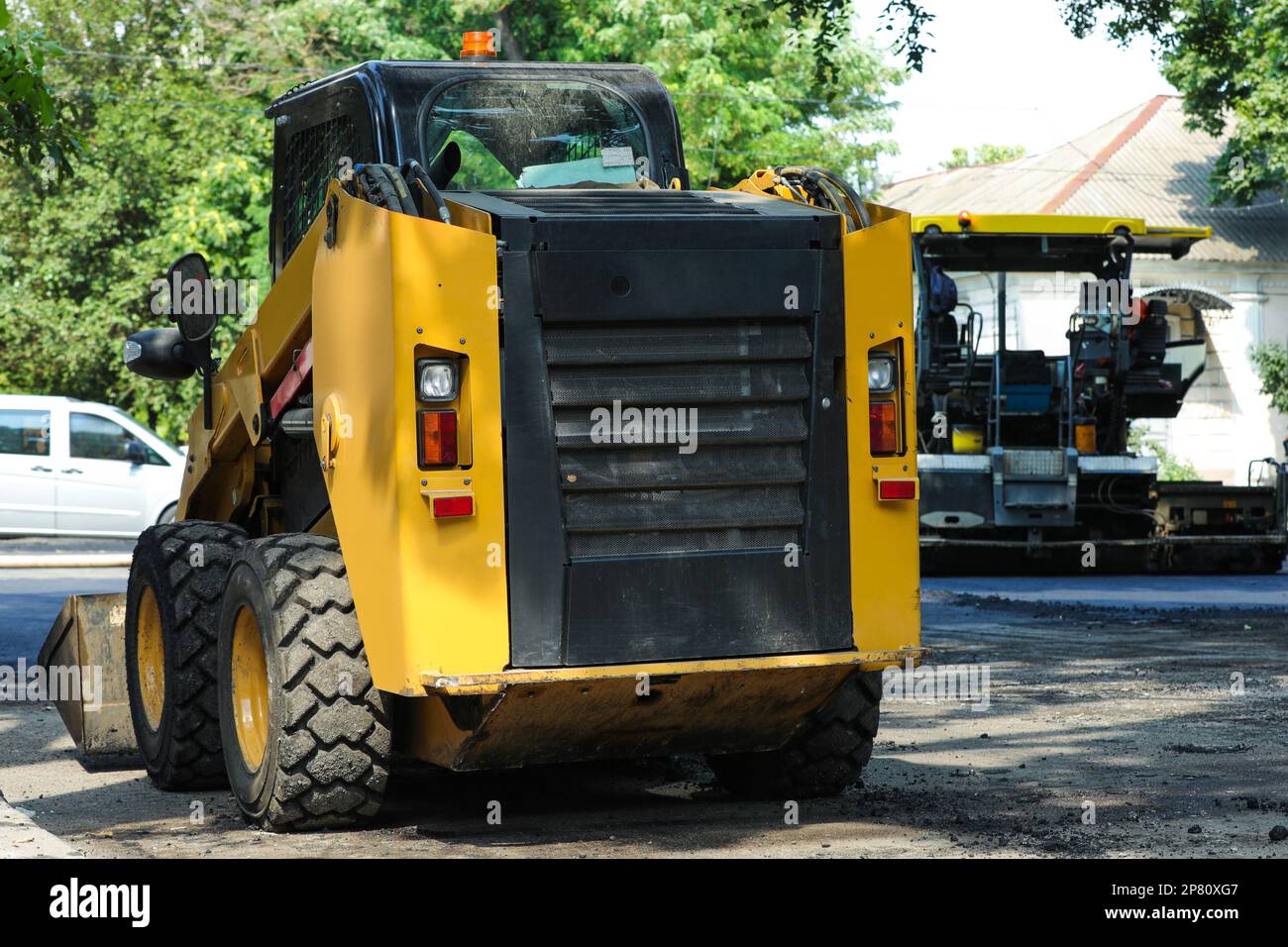 Skid loader on road hi-res stock photography and images - Alamy