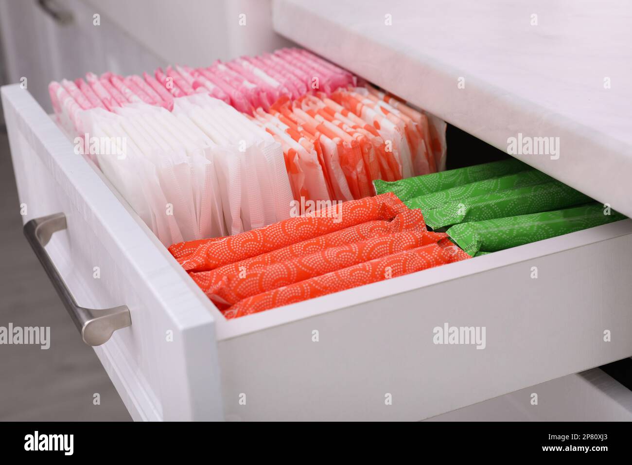 Storage of different feminine hygiene products in drawer indoors ...