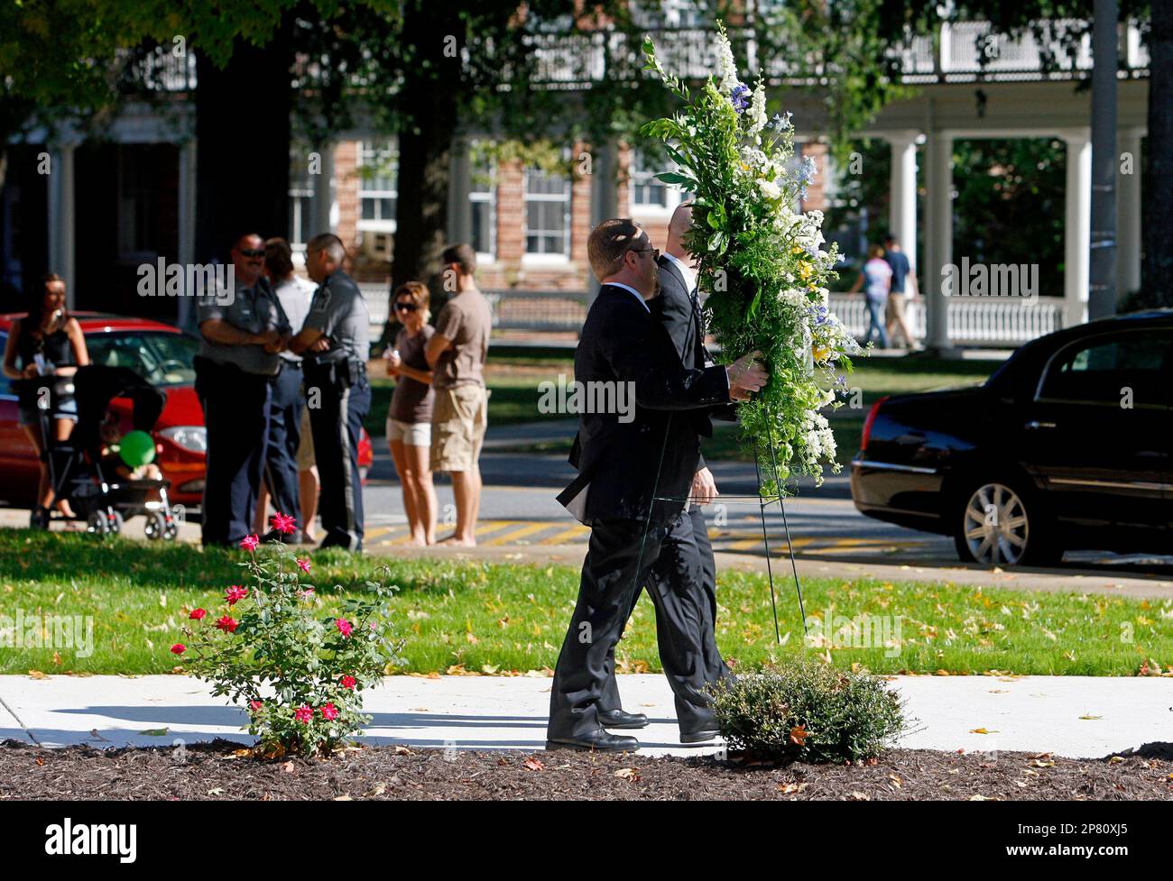 Flowers are carried out of the church funeral service for Debra S ...
