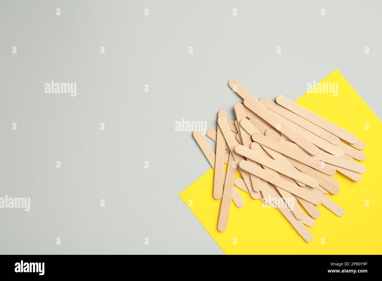 Pile of spatulas on color background, flat lay. Space for text Stock ...