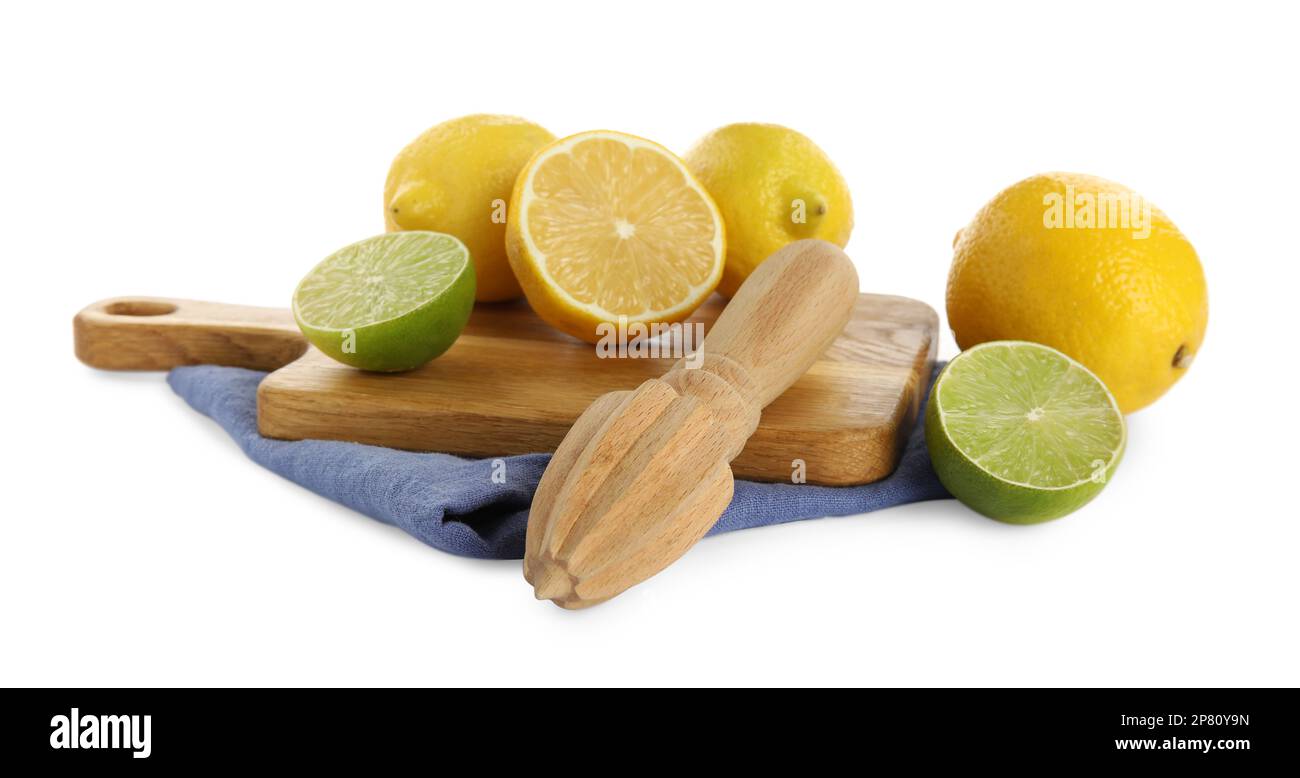 Wooden citrus reamer, fresh lemons and lime on white background Stock ...