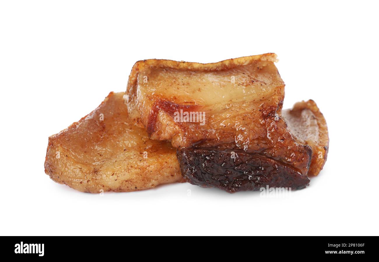 Tasty fried cracklings on white background. Cooked pork lard Stock ...