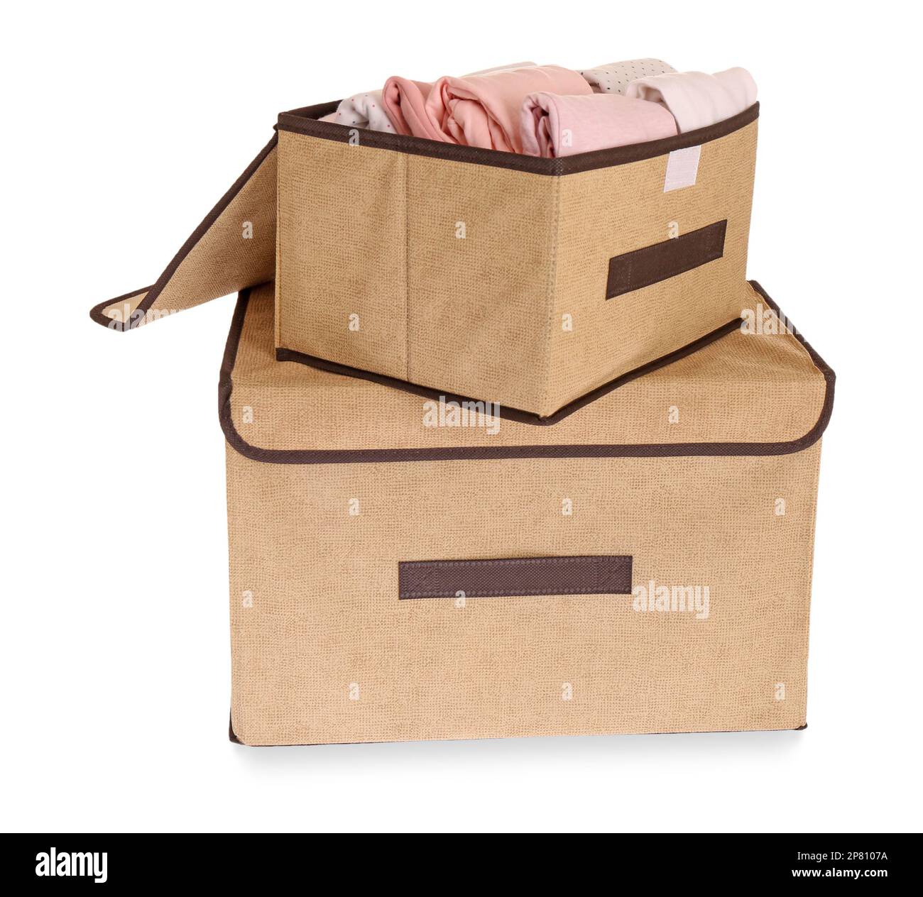 Textile storage cases with folded clothes on white background Stock ...