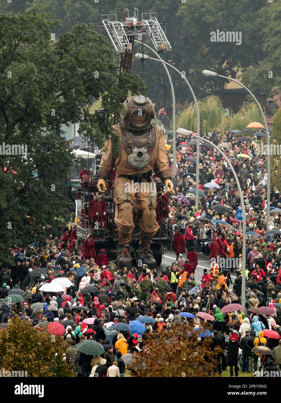 A 9.5 meter tall giant model, seen as it is transported, in Berlin ...