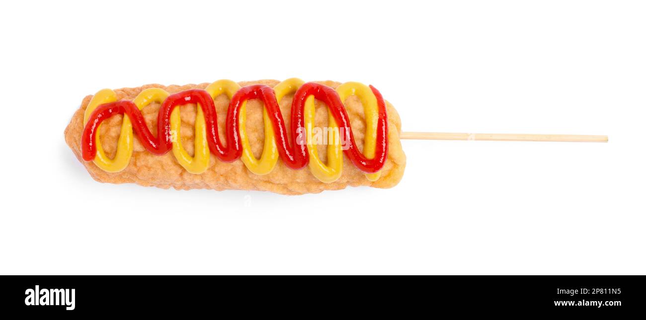 Delicious deep fried corn dog with sauces isolated on white, top view ...