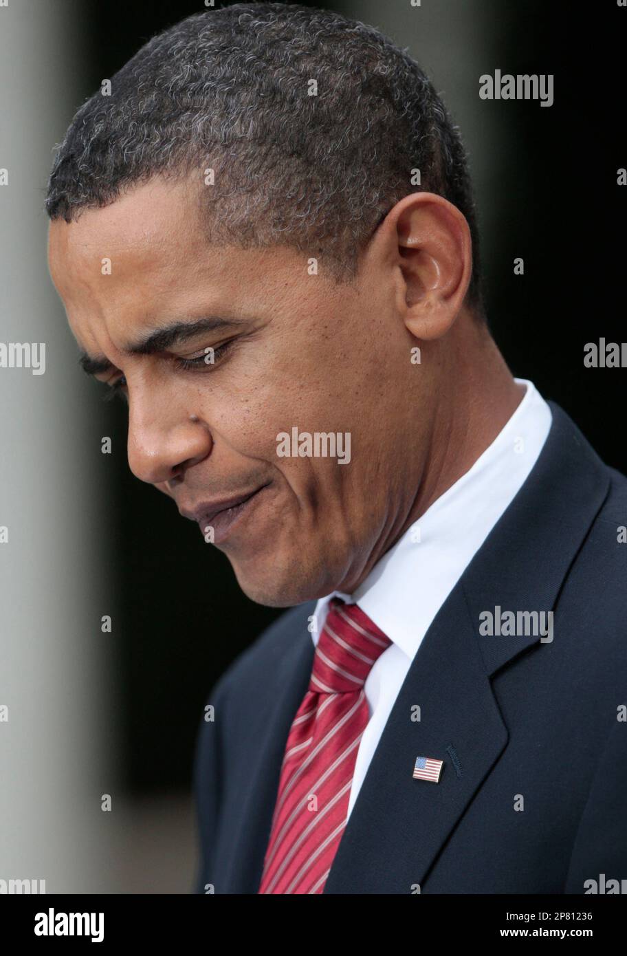 President Barack Obama pauses while speaking to members of the media in ...