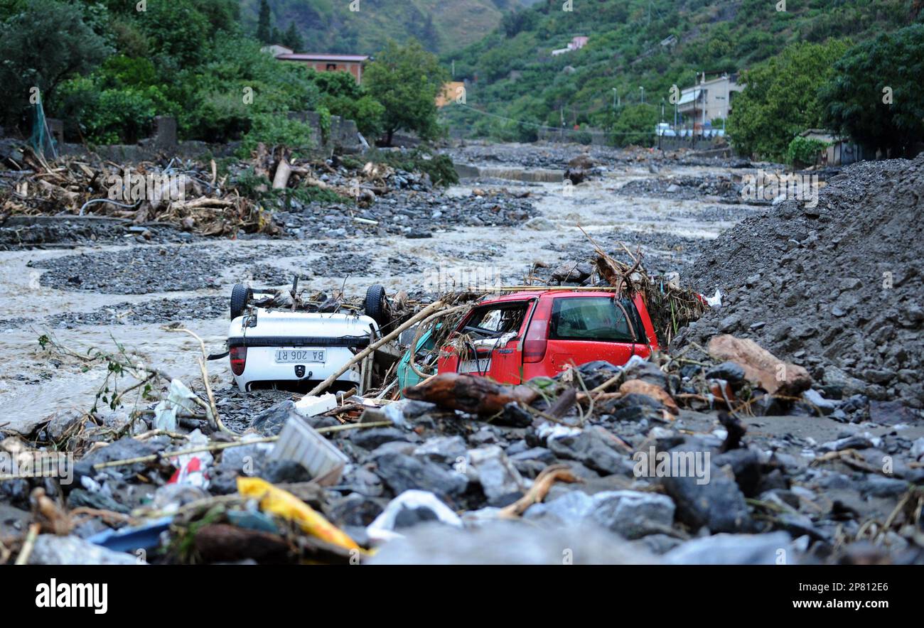 Mud, debris and cars swept away are seen in Giampilieri, near Messina ...