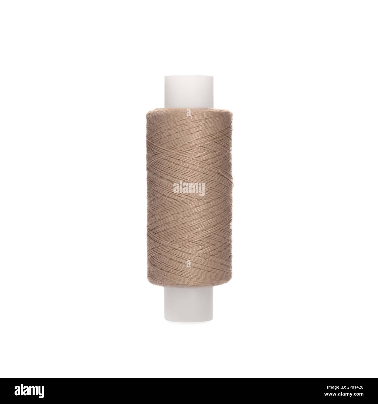 Spool of beige sewing thread isolated on white Stock Photo - Alamy