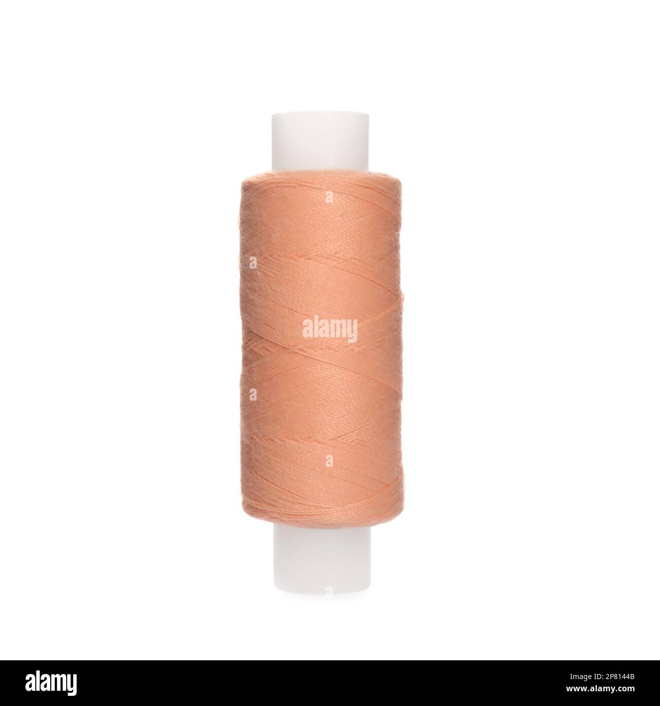 Spool of pink sewing thread isolated on white Stock Photo - Alamy