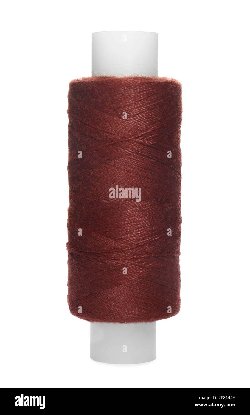 Spool of dark red sewing thread isolated on white Stock Photo - Alamy