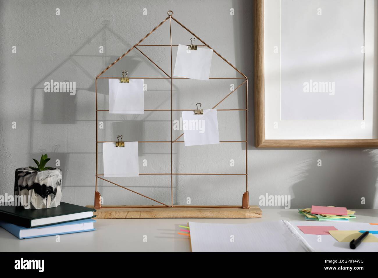 Memo board with notes on table in home office Stock Photo - Alamy