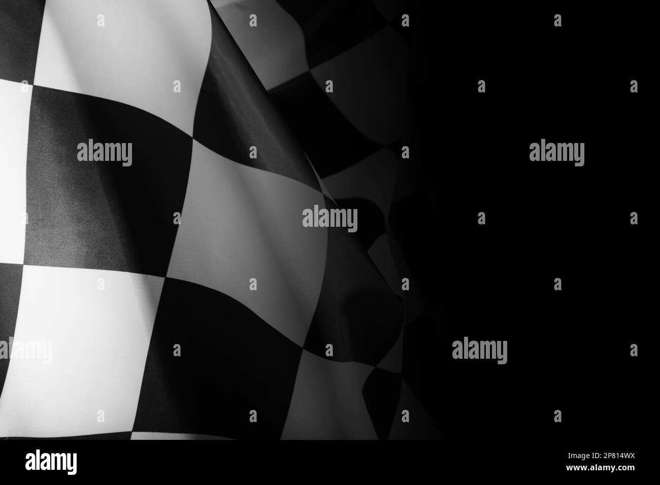 Checkered finish flag on black background, closeup Stock Photo - Alamy