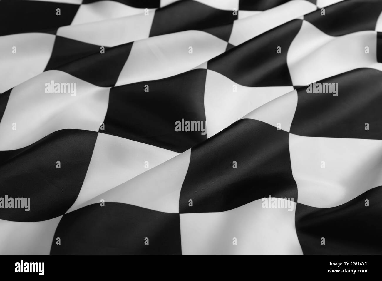 Checkered finish flag as background, closeup view Stock Photo - Alamy