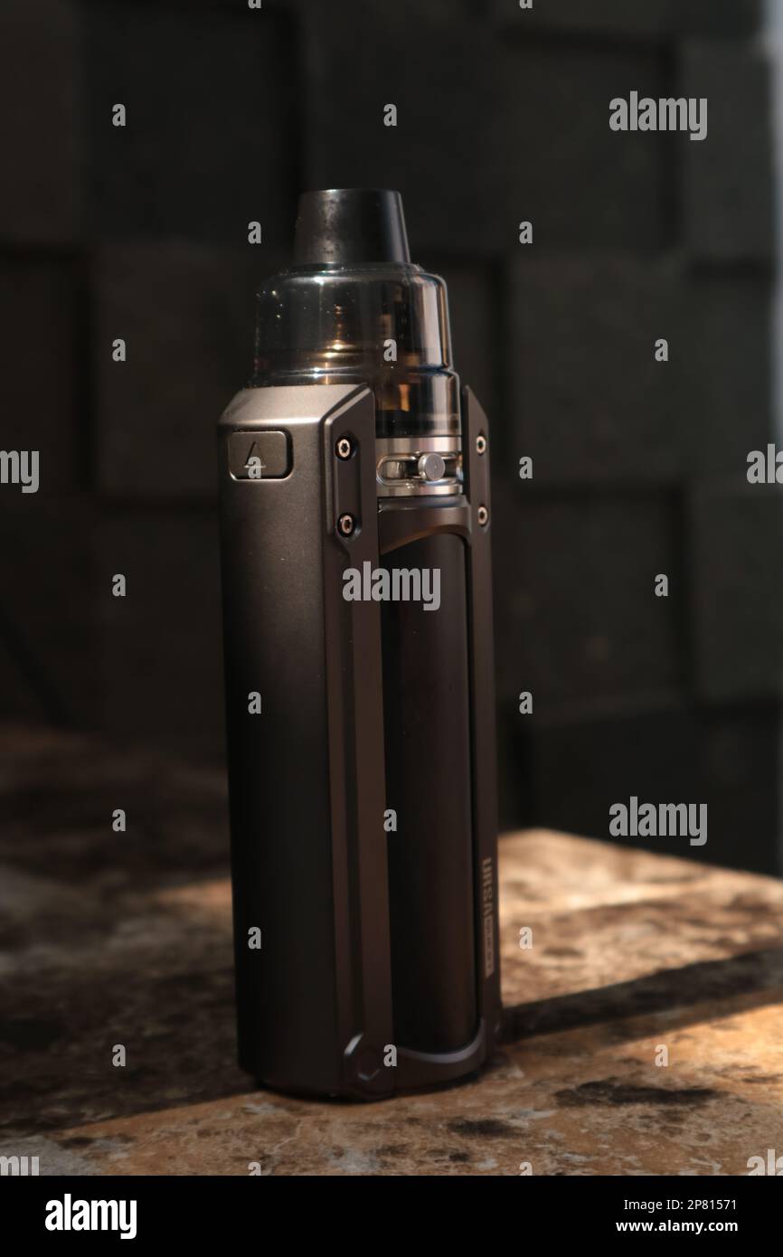 Vape on a dark background. The concept of vaping. VAPE shop. Smoking ...