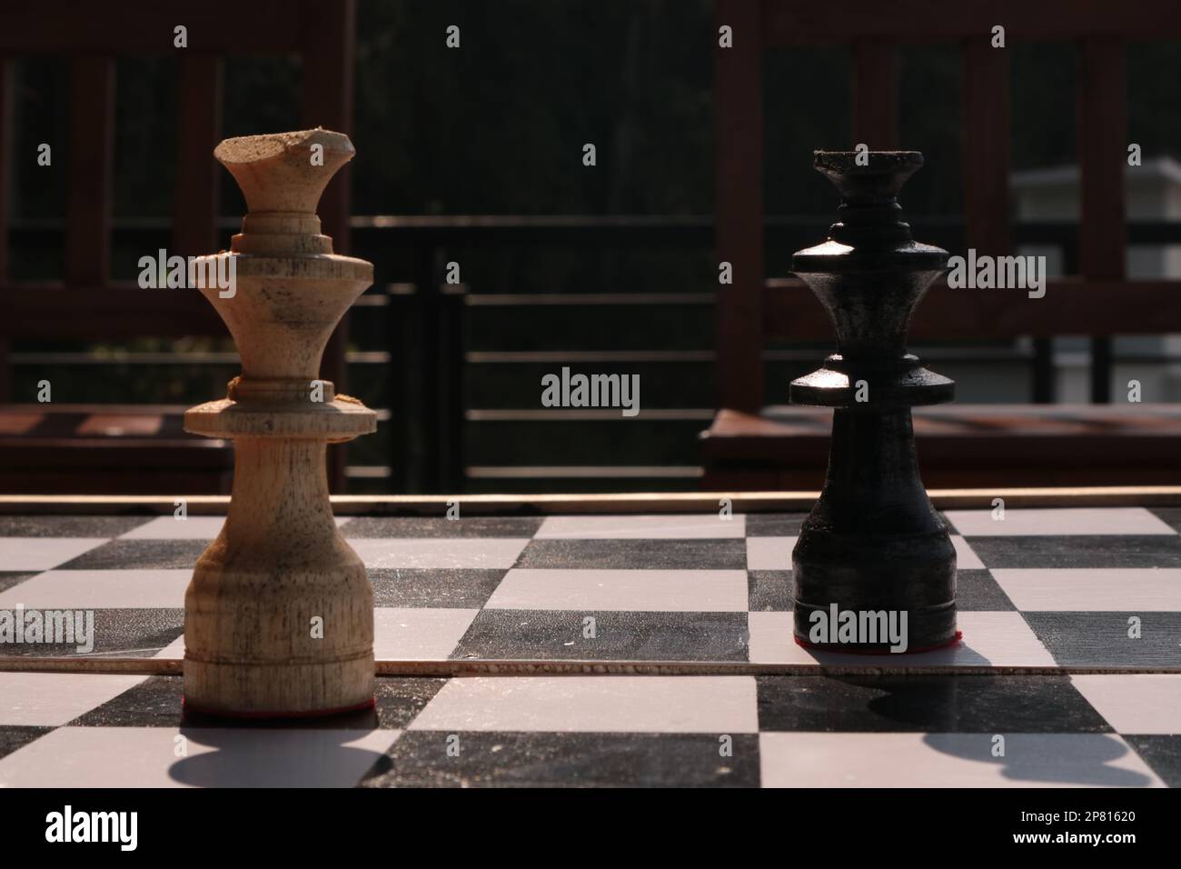 wood chess pieces on board game. great for background. with space for ...