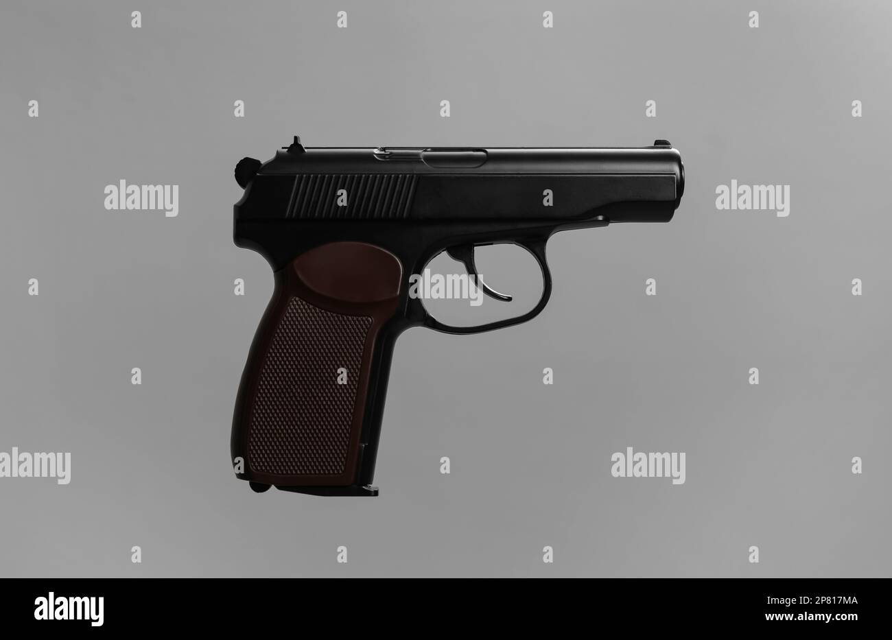 Standard handgun on grey background. Semi-automatic pistol Stock Photo ...