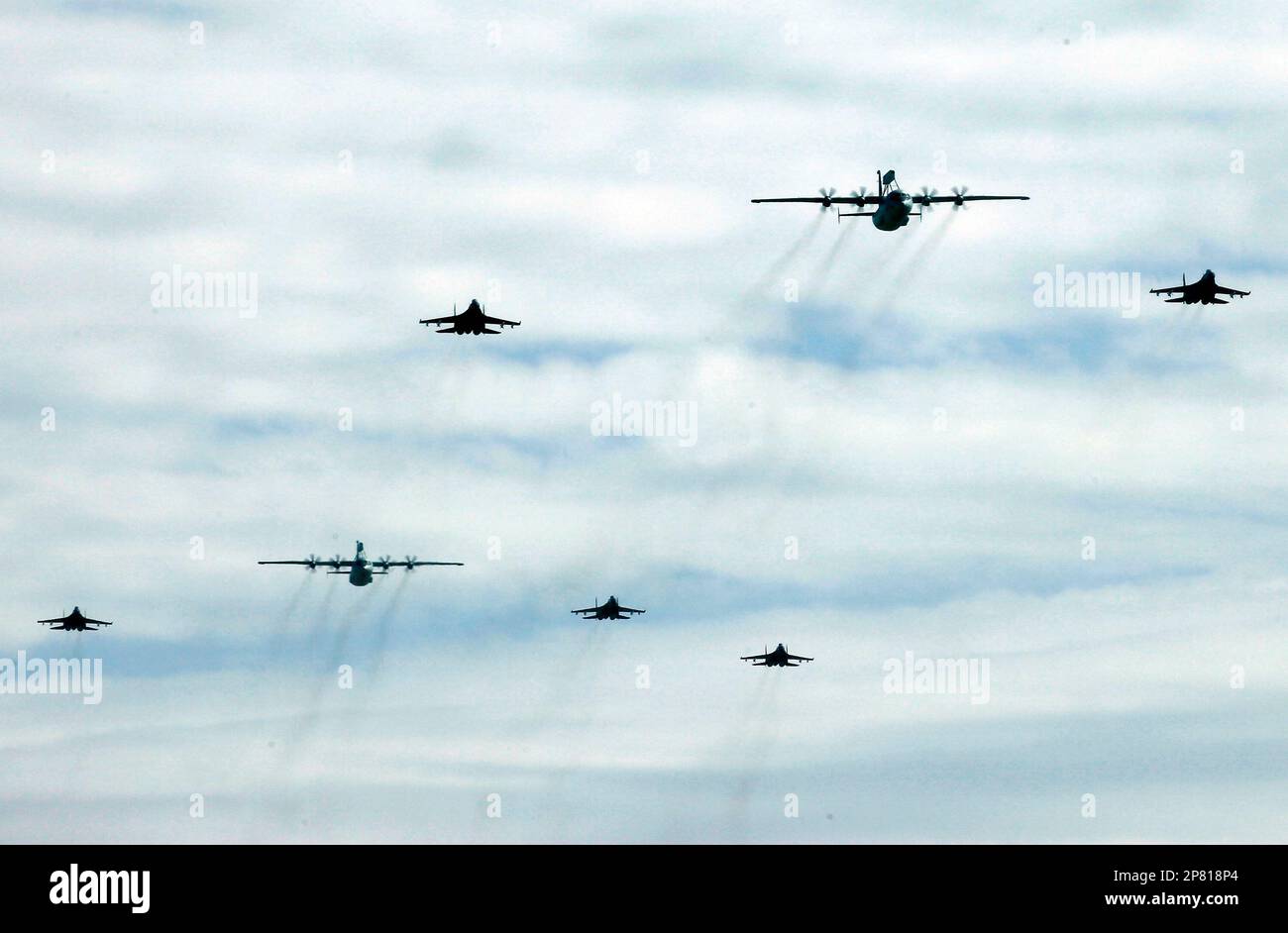 Military planes fly in formation towards Tiananmen Square during a ...
