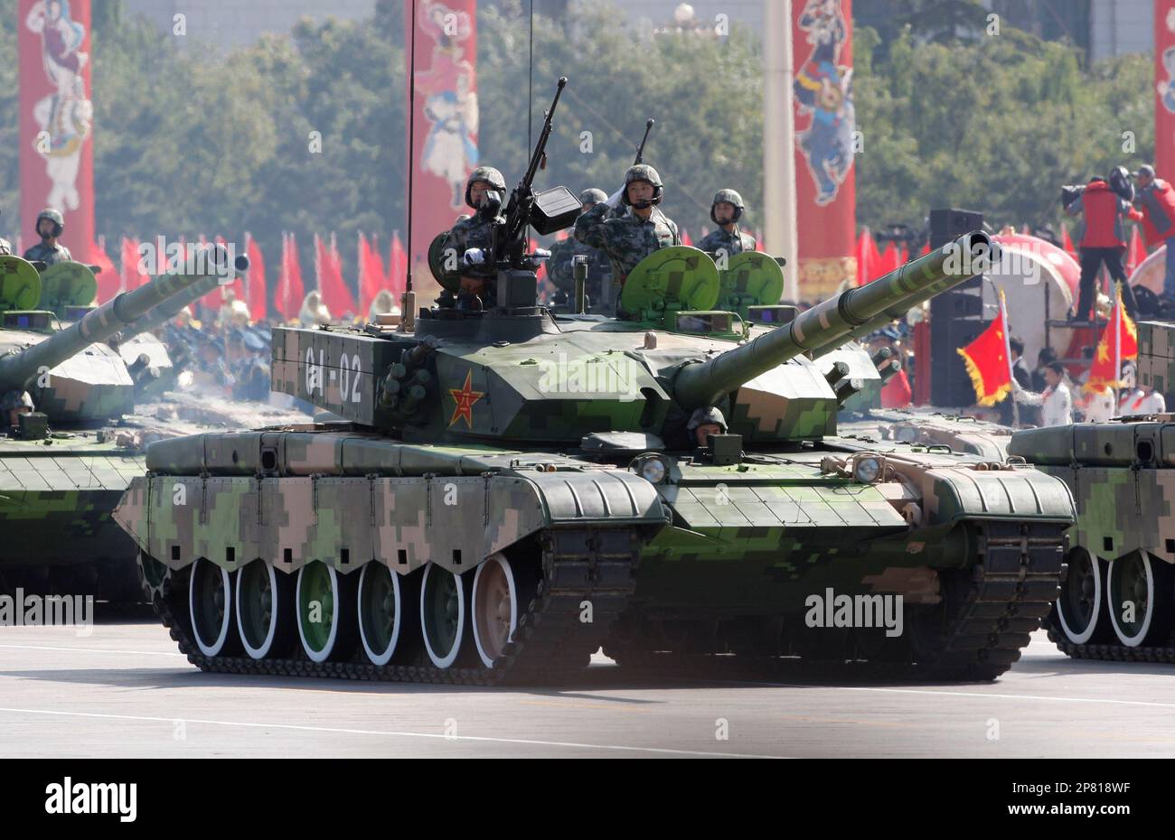 China's military tanks march past Tiananmen Square during a military ...