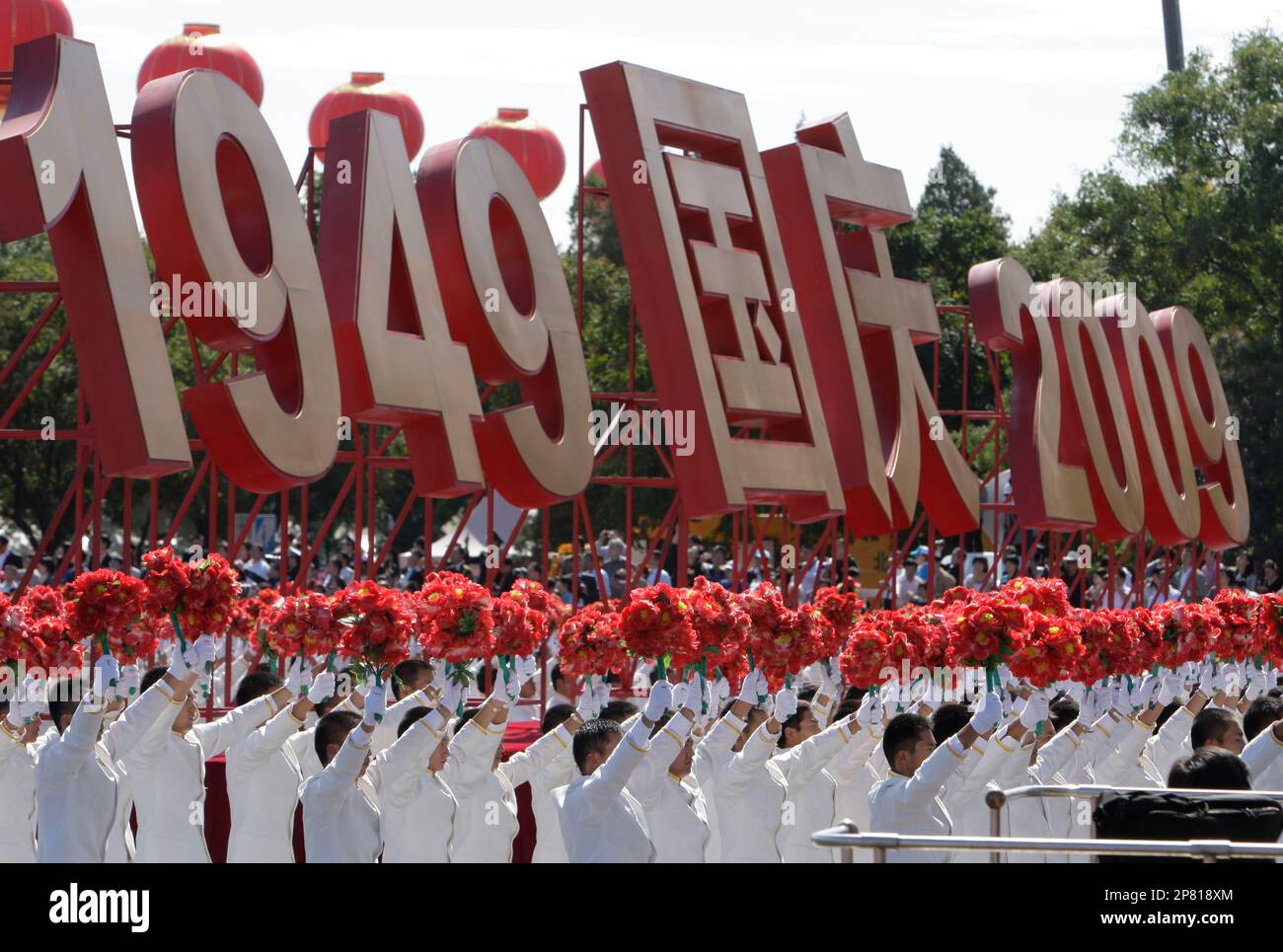 People march past Tiananmen Square during a military parade marking ...