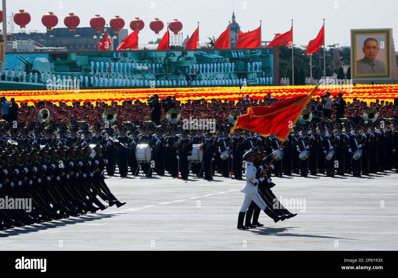 Chinese soldiers from the Army, Navy and Air force march in front of ...