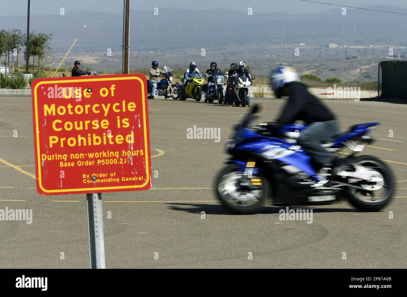 In this Sept. 10, 2009 photo, a Marine Corps motorcycle rider goes past ...