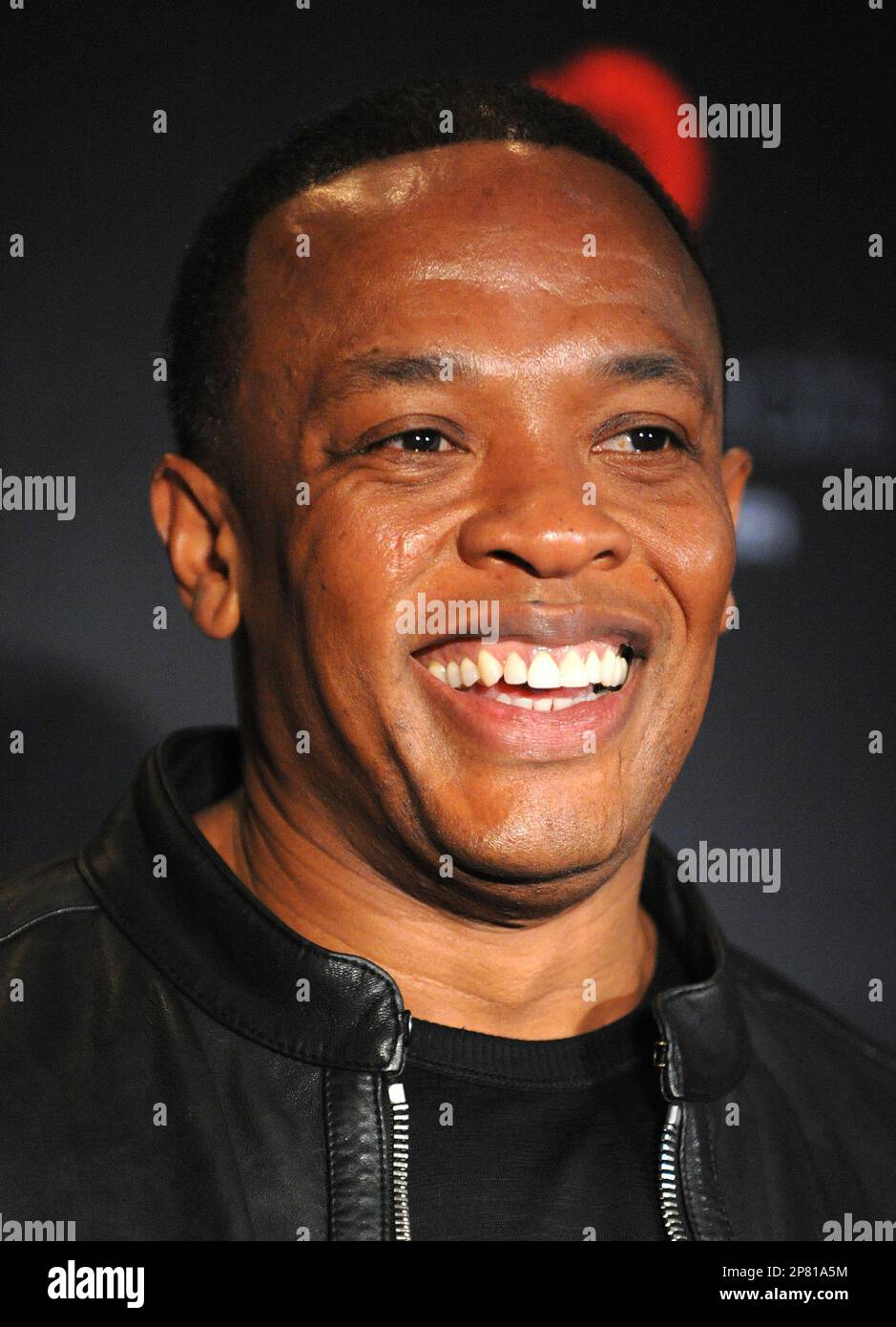 Dr. Dre poses for pictures at a press conference announcing, Heartbeats ...
