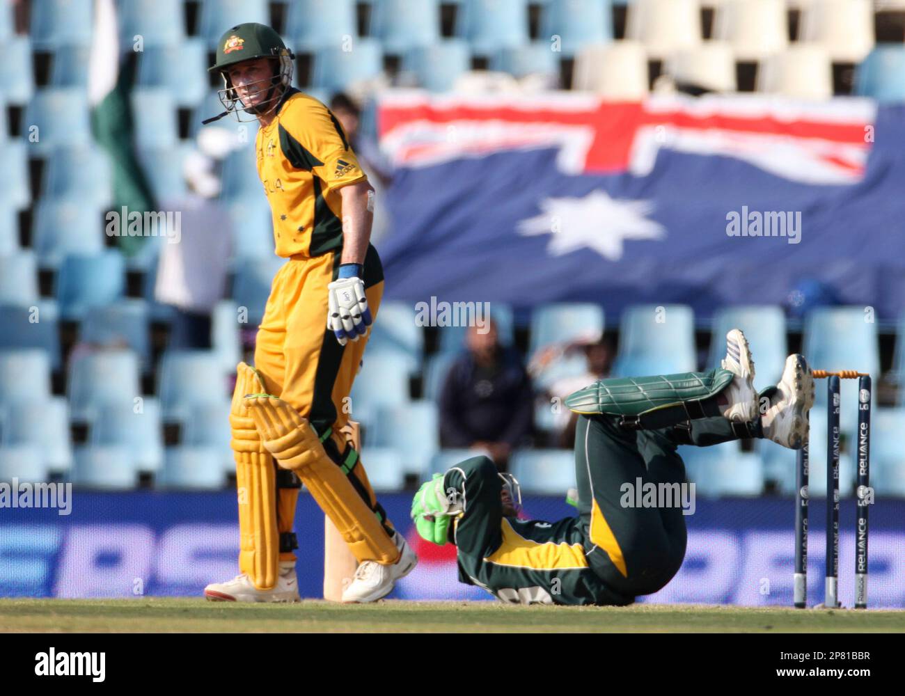 Pakistan's wicket keeper Kamran Akmal reacts as he is hit on the head ...