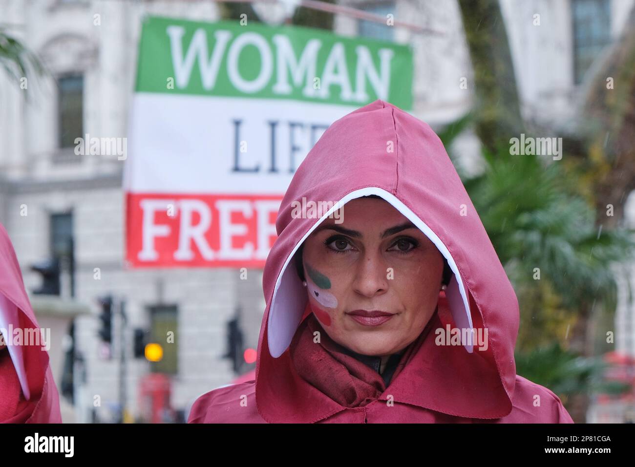 London, UK. 8th March, 2023. British-Iranian women dressed in cloaks ...