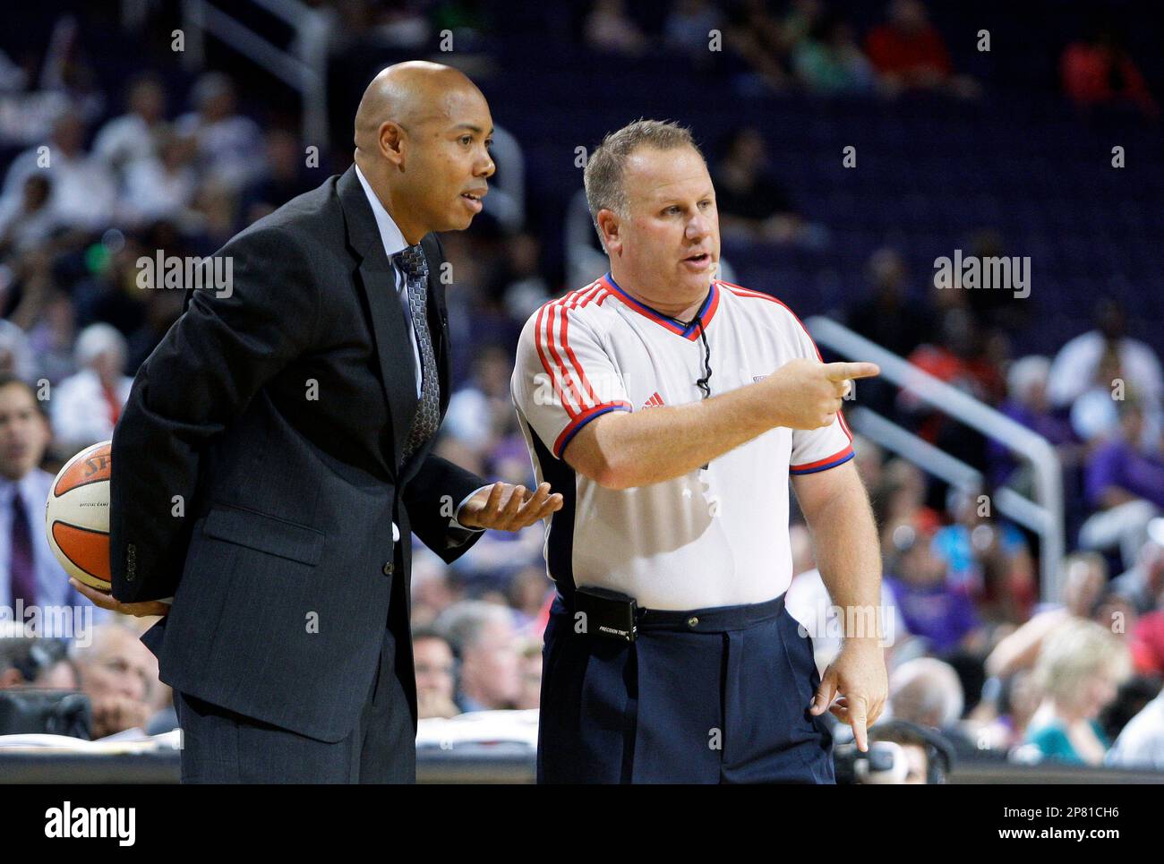 Phoenix Mercury head coach Corey Gaines, left, argues with referee Tom ...