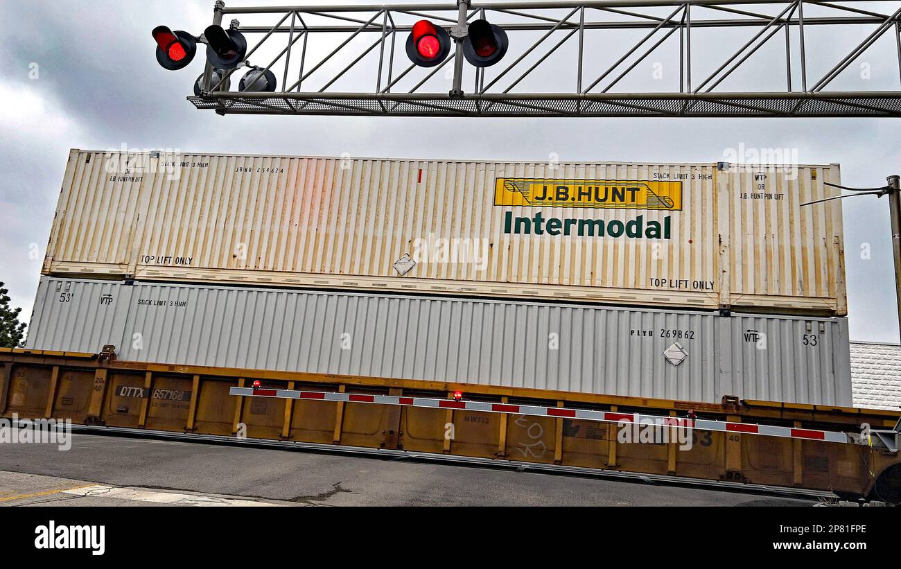 EMPORIA, KANSAS - MARCH 8, 2023 A BNSF intermodal freight train hauling cargo boxes for J.B ...