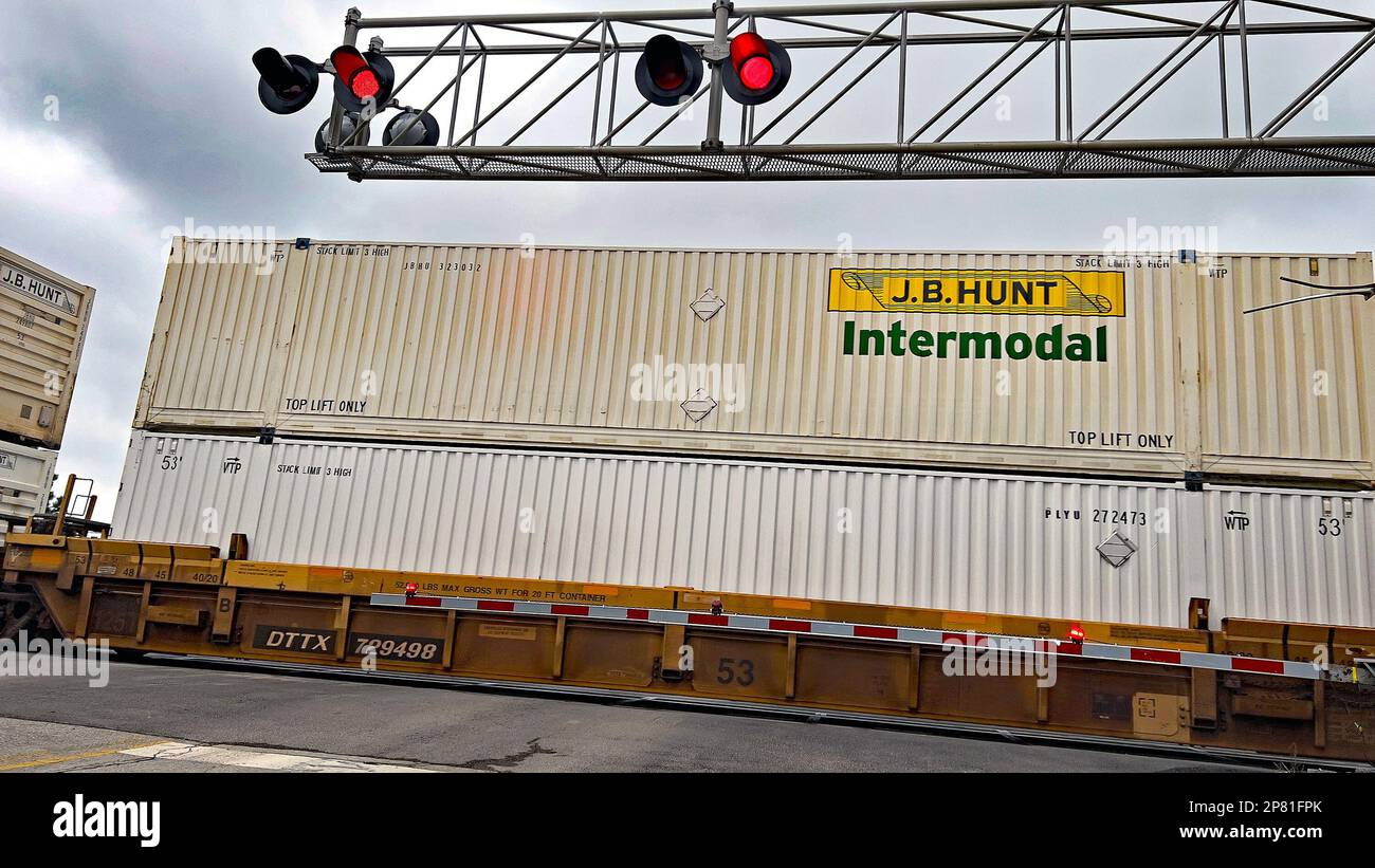 EMPORIA, KANSAS - MARCH 8, 2023 A BNSF intermodal freight train hauling cargo boxes for J.B ...
