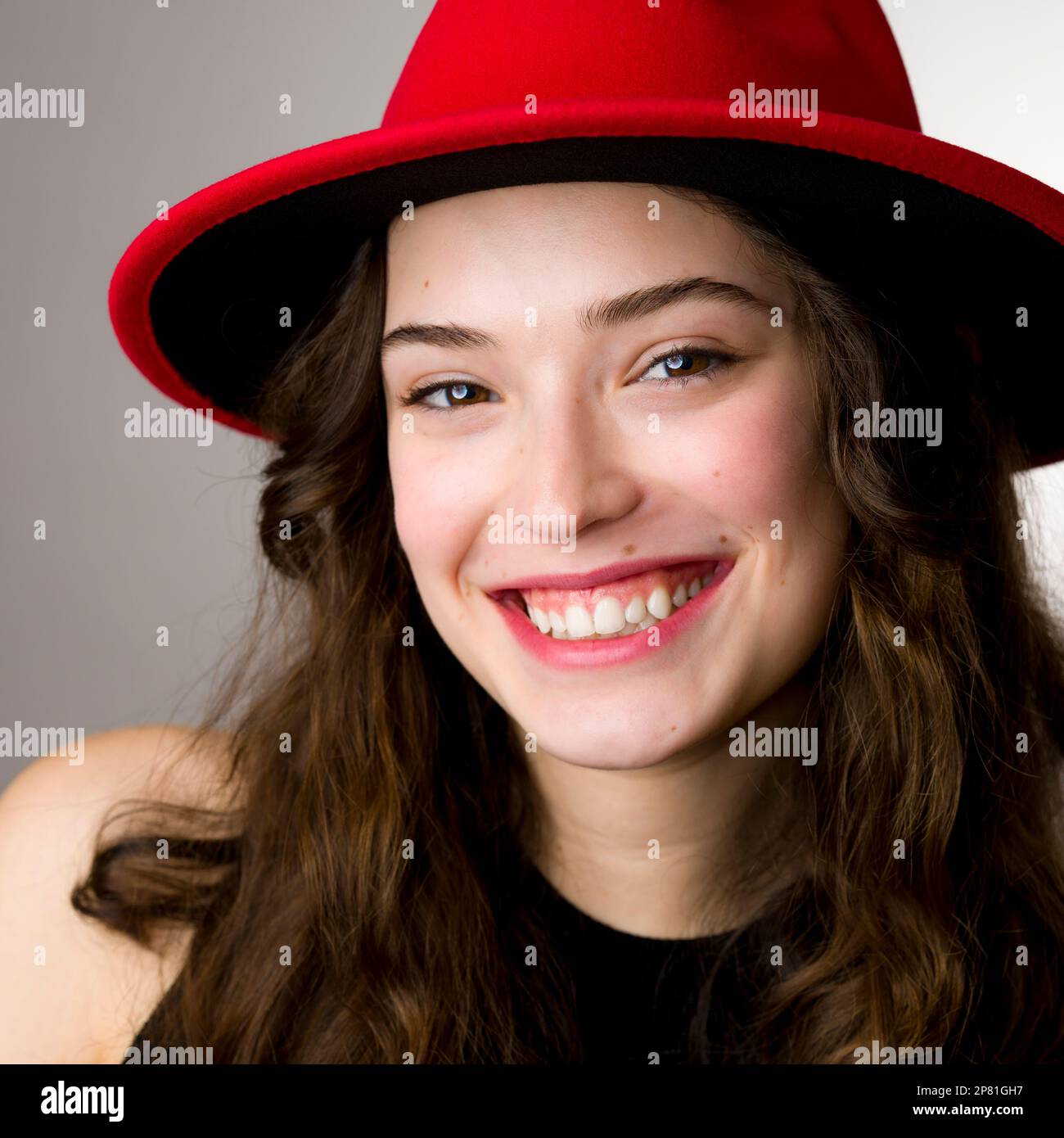 Beautiful Teenage Girl Wearing a Wide Brim Red Fedora | Smiling ...